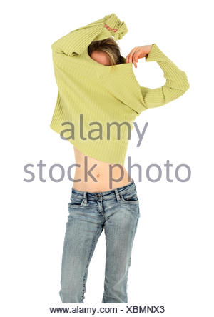 Pretty woman takes off a green sweater Stock Photo: 90474629 - Alamy