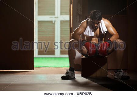 Boxer sitting on stool corner of boxing ring Stock Photo - Alamy