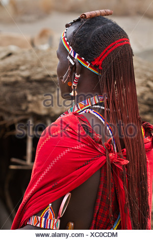 Portrait of Maasai moran or warrior wearing red ochre make up and ...