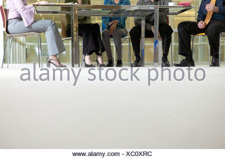 Feet under a table Stock Photo: 12002412 - Alamy