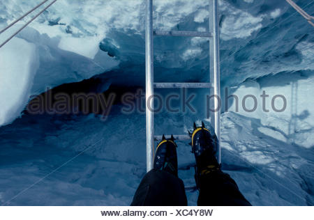 Crossing a crevasse ladder in the Khumbu Icefall on Mount Everest Stock ...