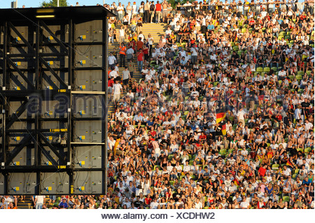 Crowds in the stands of Olympic Stadium, with runners on the starting ...