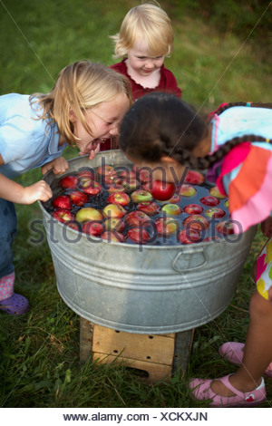 Children apple bobbing Stock Photo: 47396640 - Alamy