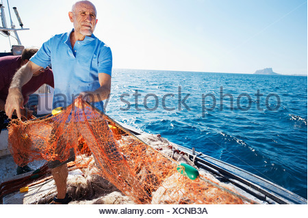 People pulling a fishing net in the southern coast of Sri Lanka Stock ...