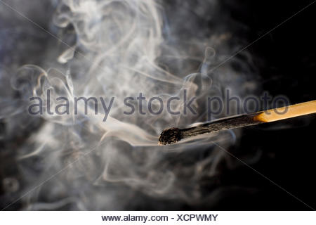 An extinguished but smoking match Stock Photo: 28168100 - Alamy