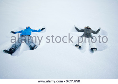 Couple doing snow angel Stock Photo: 96905294 - Alamy