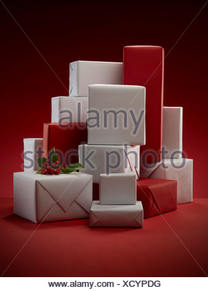 A large group of gift wrapped Christmas presents in a colourful Stock ...