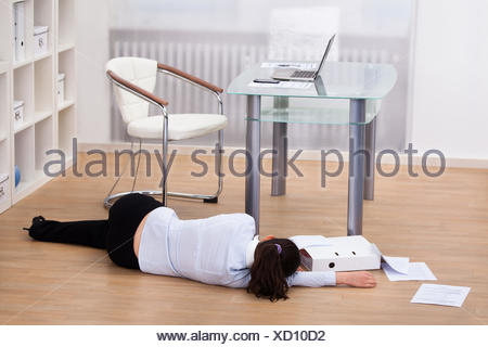 Exhausted Businesswoman Fainted On Floor At Workplace Stock Photo ...