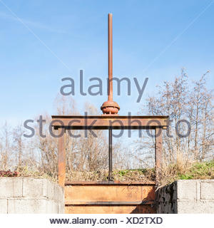 Irrigation Canal and old and manual Flood gate valve Stock Photo ...