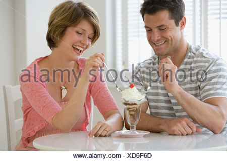 Couple sharing ice cream sundae Stock Photo: 14566613 - Alamy