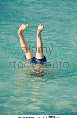 Boy doing a handstand in a swimming pool Stock Photo - Alamy
