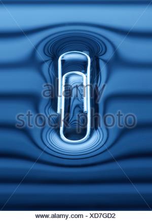 Floating Paperclip. Paper clip floating on water courtesy of surface ...