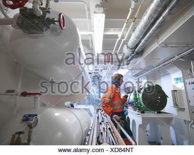 Marine engineer working in ship's workshop in engine control room Stock ...