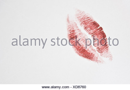 Red lipstick stain on white background Stock Photo - Alamy