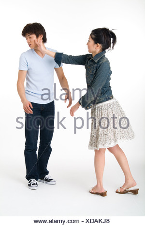 Young woman slapping her boyfriend Stock Photo - Alamy