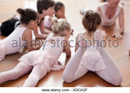 Ballet dancer lying on floor listening to music Stock Photo: 62465631 ...