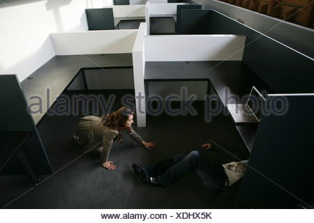 Office workers crawling under their desks Stock Photo: 4821675 - Alamy
