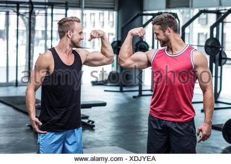 Two muscular men flexing biceps Stock Photo: 88819860 - Alamy