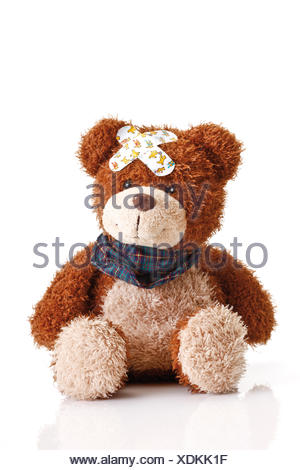 Teddy bear with band-aids on its head Stock Photo - Alamy