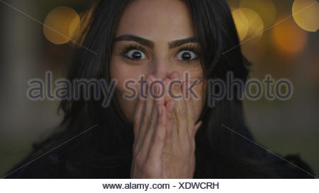 Close up of woman gasping Stock Photo - Alamy