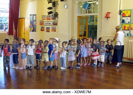 Nursery children lining up in school hall Stock Photo - Alamy