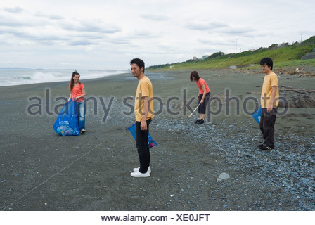 Young people cleaning beach Stock Photo: 16823934 - Alamy