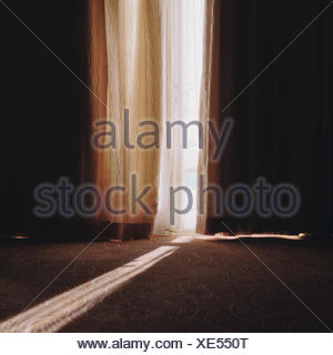 Light Shining Through Window In Old Stone Wall At Night Stock Photo ...