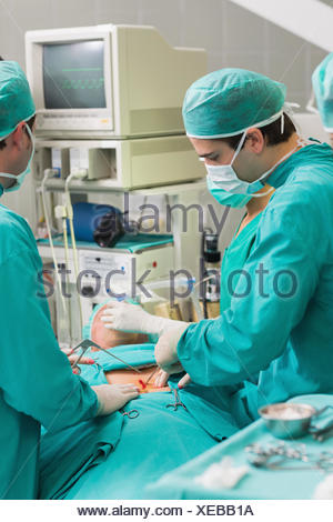 Surgeons using surgical tools Stock Photo: 49489076 - Alamy