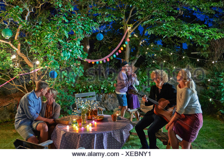 Young family of three having fun together outdoor. Pretty little Stock ...