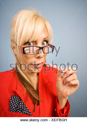 Portrait of businesswoman pulling chewing gum, smiling Stock Photo ...