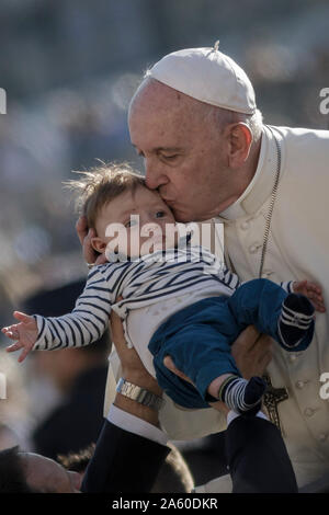 Pope Francis kisses a child during his visit in Lund, Sweden Monday ...