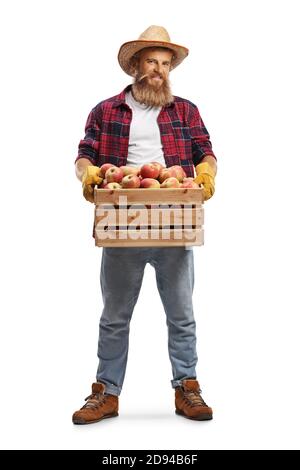 Ein lächelnder kaukasischer bärtiger Bauer, der in der Hocke hockt ...