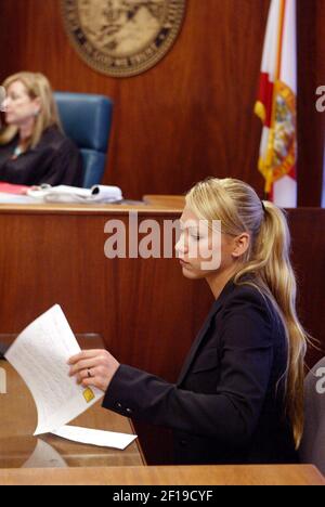 Tennis star Anna Kournikova reads portions of a letter from accused ...