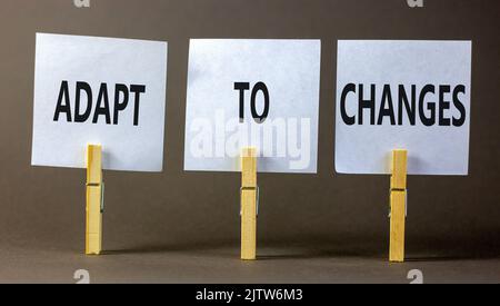 Anpassung an Änderungen und Support-Symbol. Konzept Wörter passen sich ...