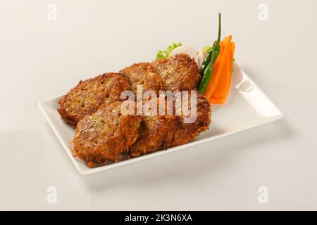 Fotografie mit traditionellen Speisen von Shami Kabab. Jali kabab im ...