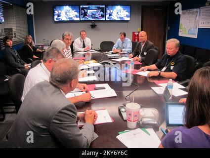 FEMA Regional Administrator Tony Robinson listens at right as Louisiana ...