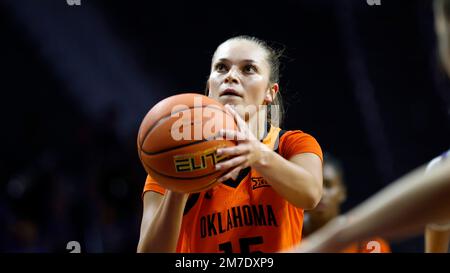 Oklahoma State guard Lexy Keys (15) falls to the court as she battles ...
