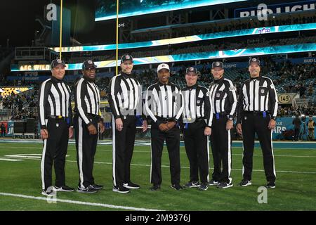 Officials, from left, field judge Joe Blubaugh, umpire Barry Anderson ...