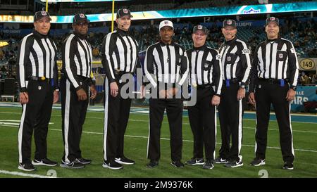Officials, from left, field judge Joe Blubaugh, umpire Barry Anderson ...