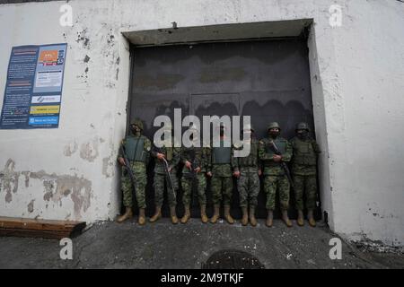 Soldiers guard an entrance to the Inca jail as a forensic crime scene ...
