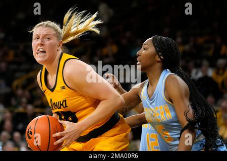 Iowa forward Monika Czinano, left, celebrates with teammate Caitlin ...
