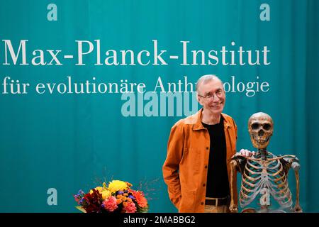 Swedish scientist Svante Paabo poses behind a replica of a Neanderthal ...