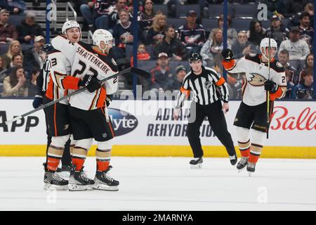 Anaheim Ducks' Simon Benoit, left, watches a shot by Toronto Maple ...