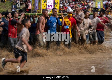 Pnar, or Jaintia, tribals carry 'Rongs' or chariots and dance in muddy ...