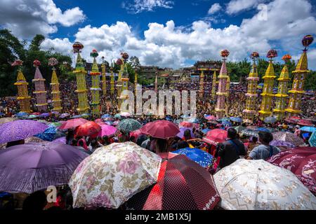Pnar, or Jaintia, tribals carry 'Rongs' or chariots and dance in muddy ...