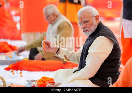 FILE - Indian Prime Minister Narendra Modi, center, unveils the logo of ...