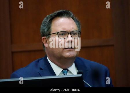 Dr. Richard Moore, Jr., testifies in the courtroom at the Fairfax ...