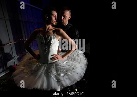 Anastasia Matvienko, and her husband Denis Matvienko, both from Ukraine, warm up before a ...