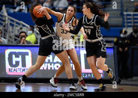 From the left, Connecticut's Caroline Ducharme, Paige Bueckers, Piath ...