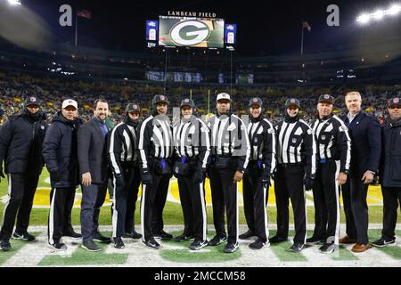 The officiating crew pose for a picture including line judge Rusty ...